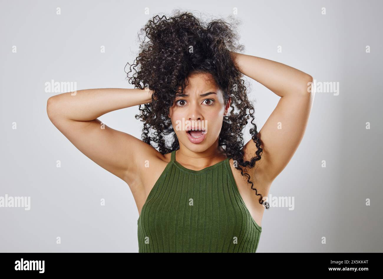 Portrait, messy and woman with hair, shocked expression and surprise on ...
