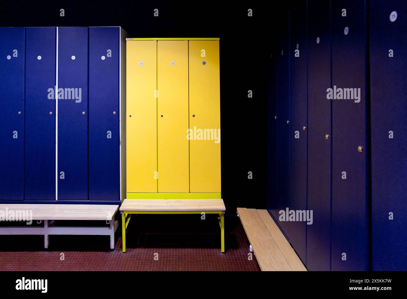 A changing room with blue and yellow locker doors in a spa hotel Stock ...