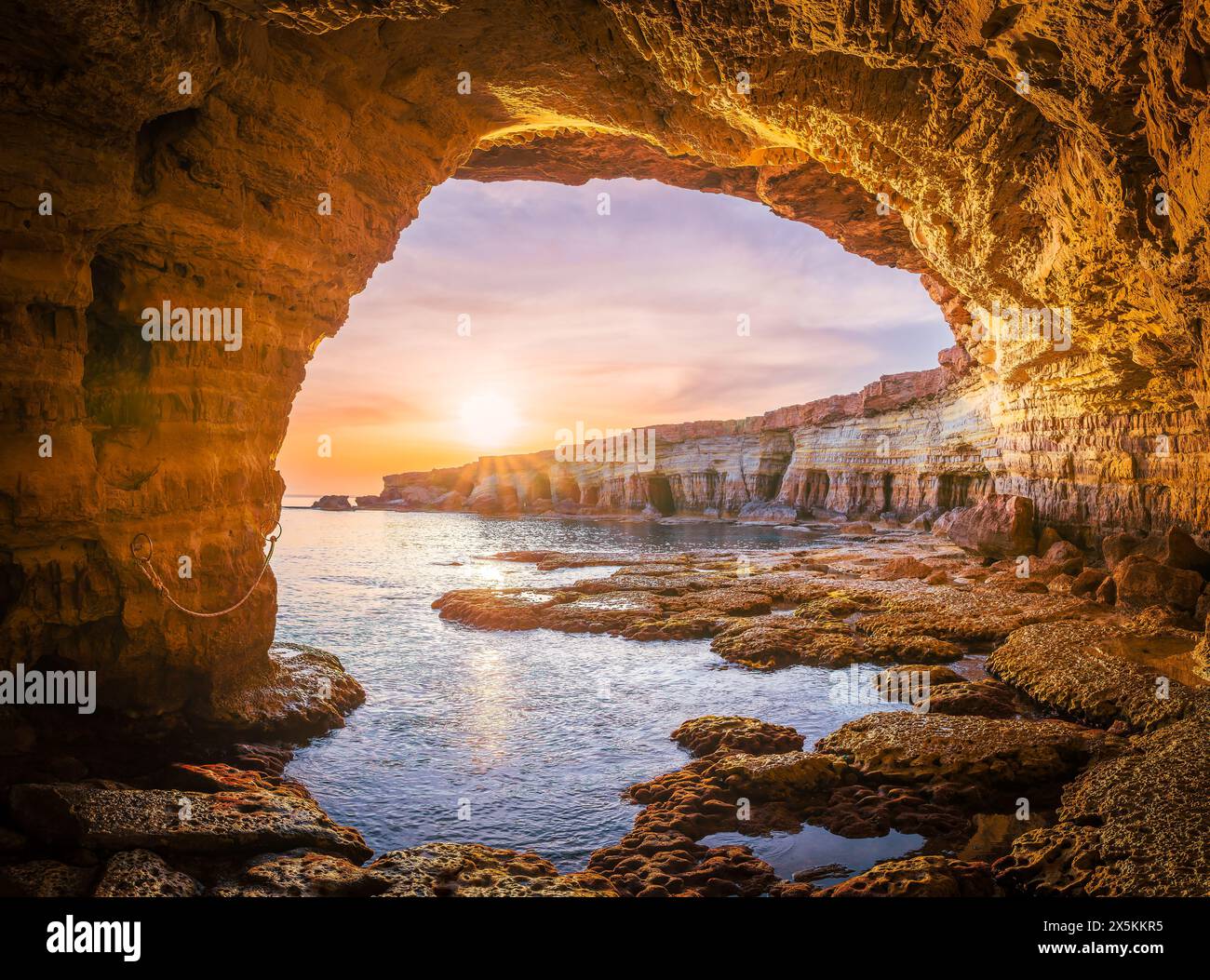 Stunning sunset view of Ayia Napa sea caves in Cyprus, showcasing a ...