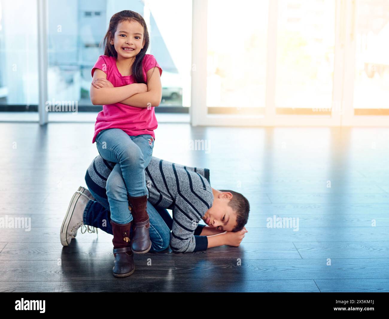 Kids, play and funny siblings in home, brother and sister in living ...