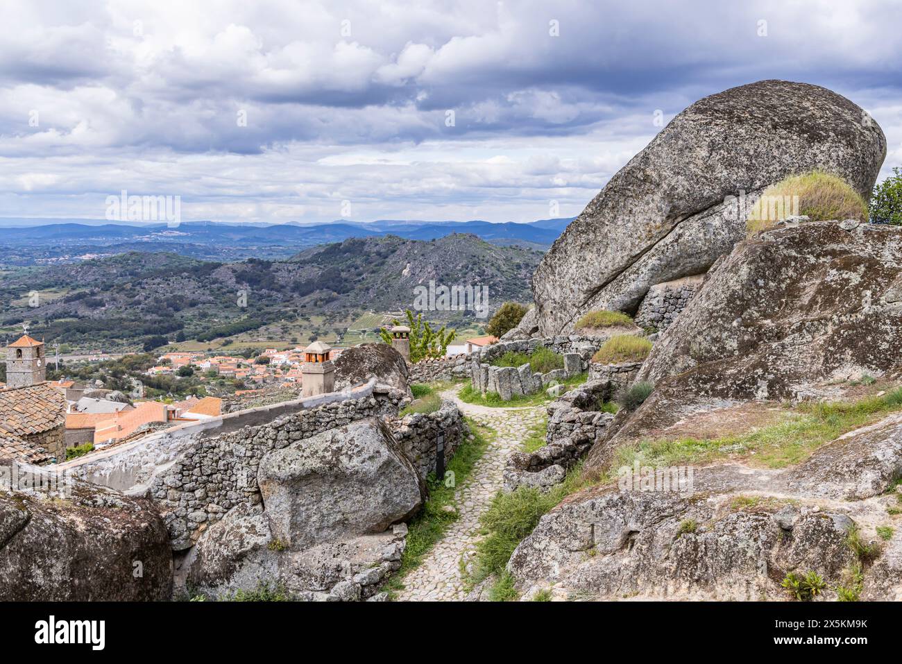 Portugal, Monsanto. Pathway with stone walls winding through boulders ...