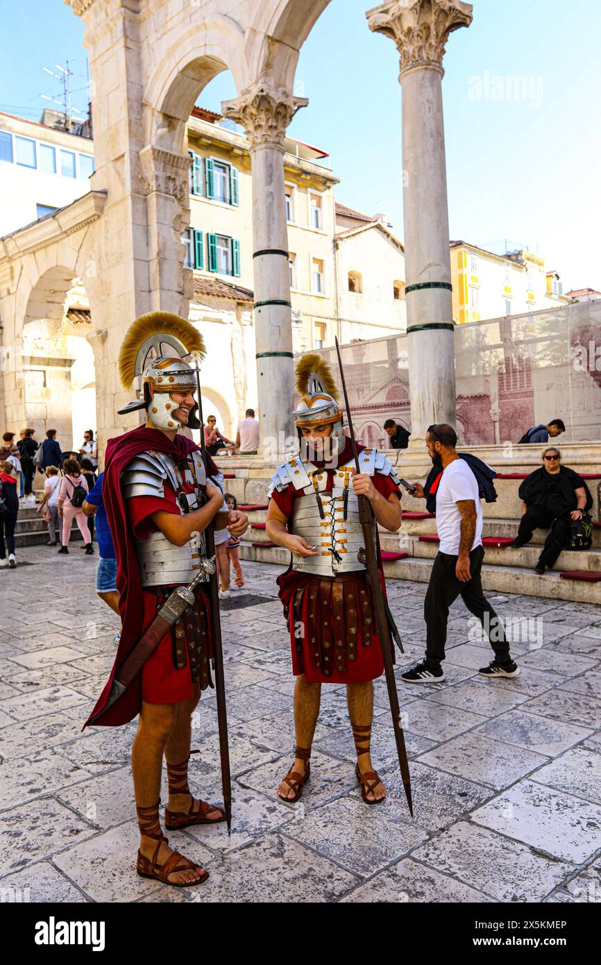 Split, Croatia. Old town square with Roman armor clad soldiers laughing ...