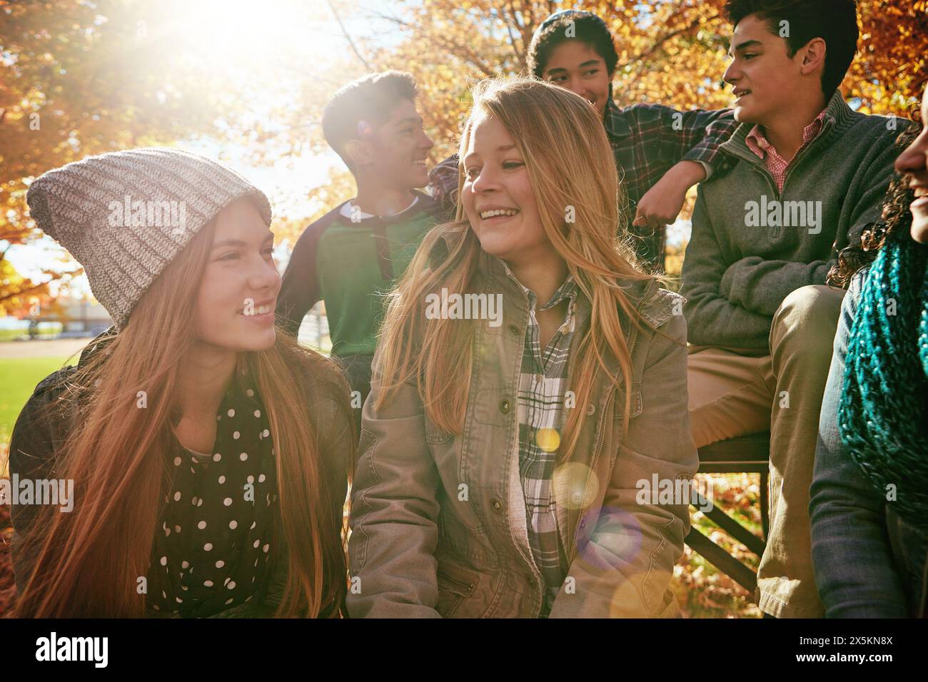 Talking, teenagers and friends outdoor in park for relaxing day on ...