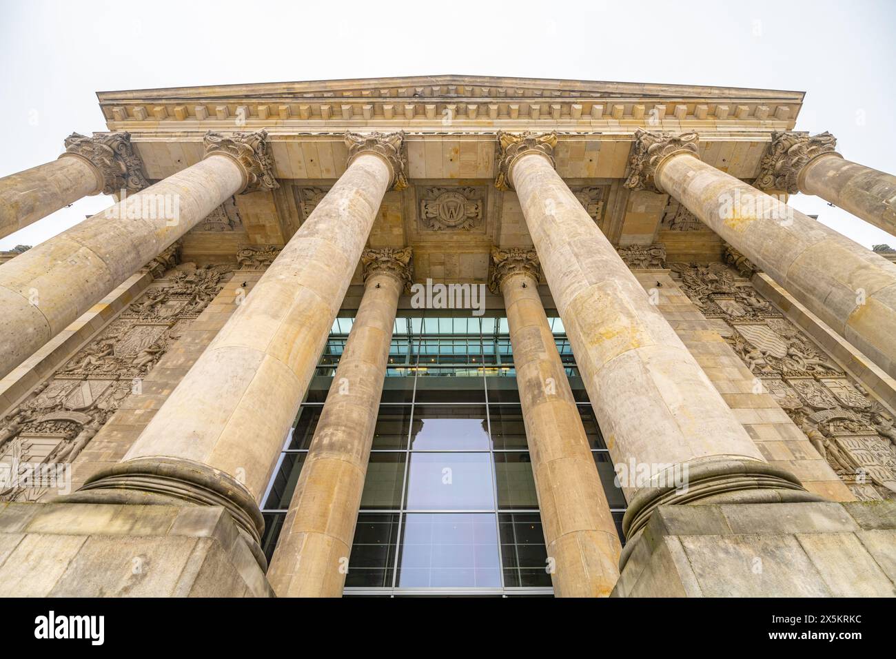 The neoclassical portal with columns of the Reichstag with its iconic ...