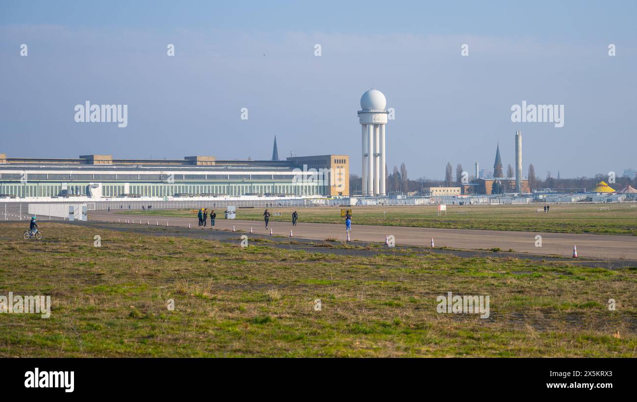 The intricate metal spiral ramp leading upwards inside the modern glass ...