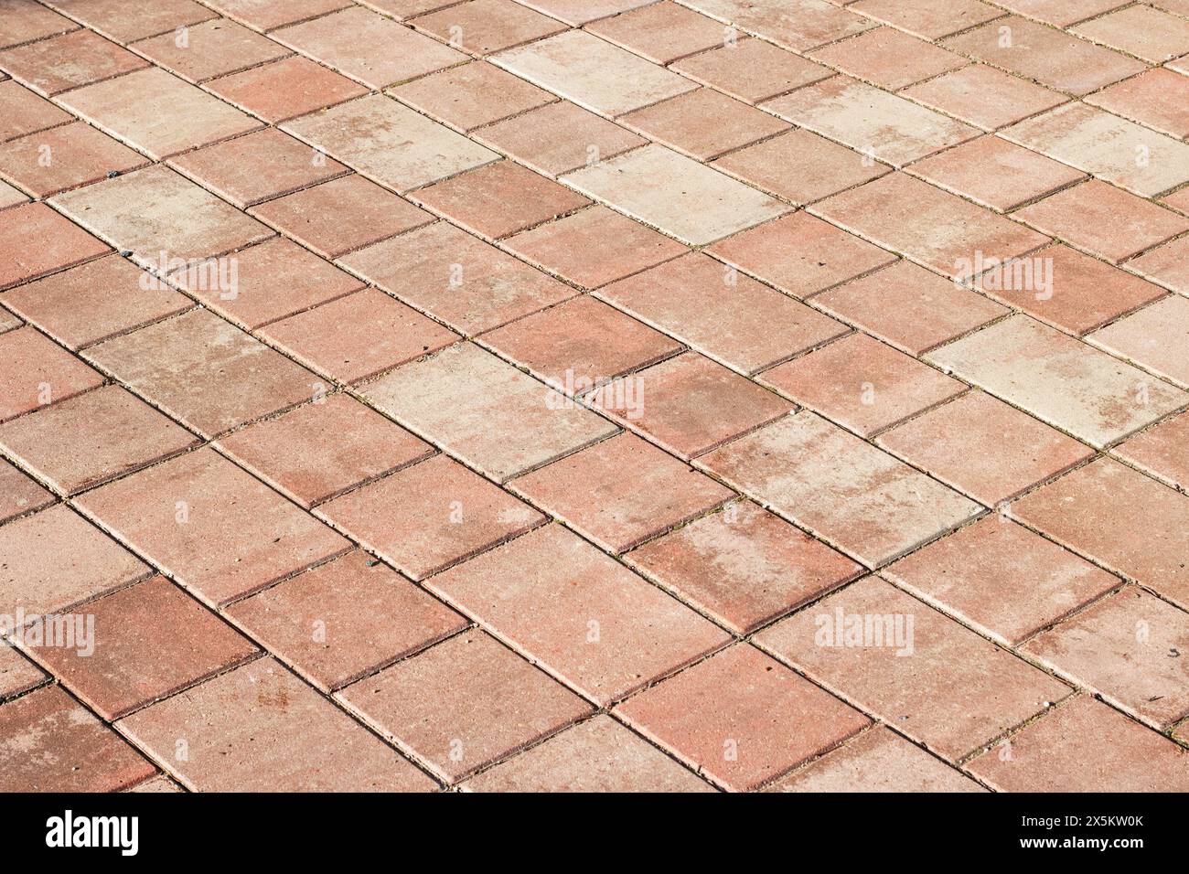 An upclose shot of a diagonal patterned red brick floor, resembling ...