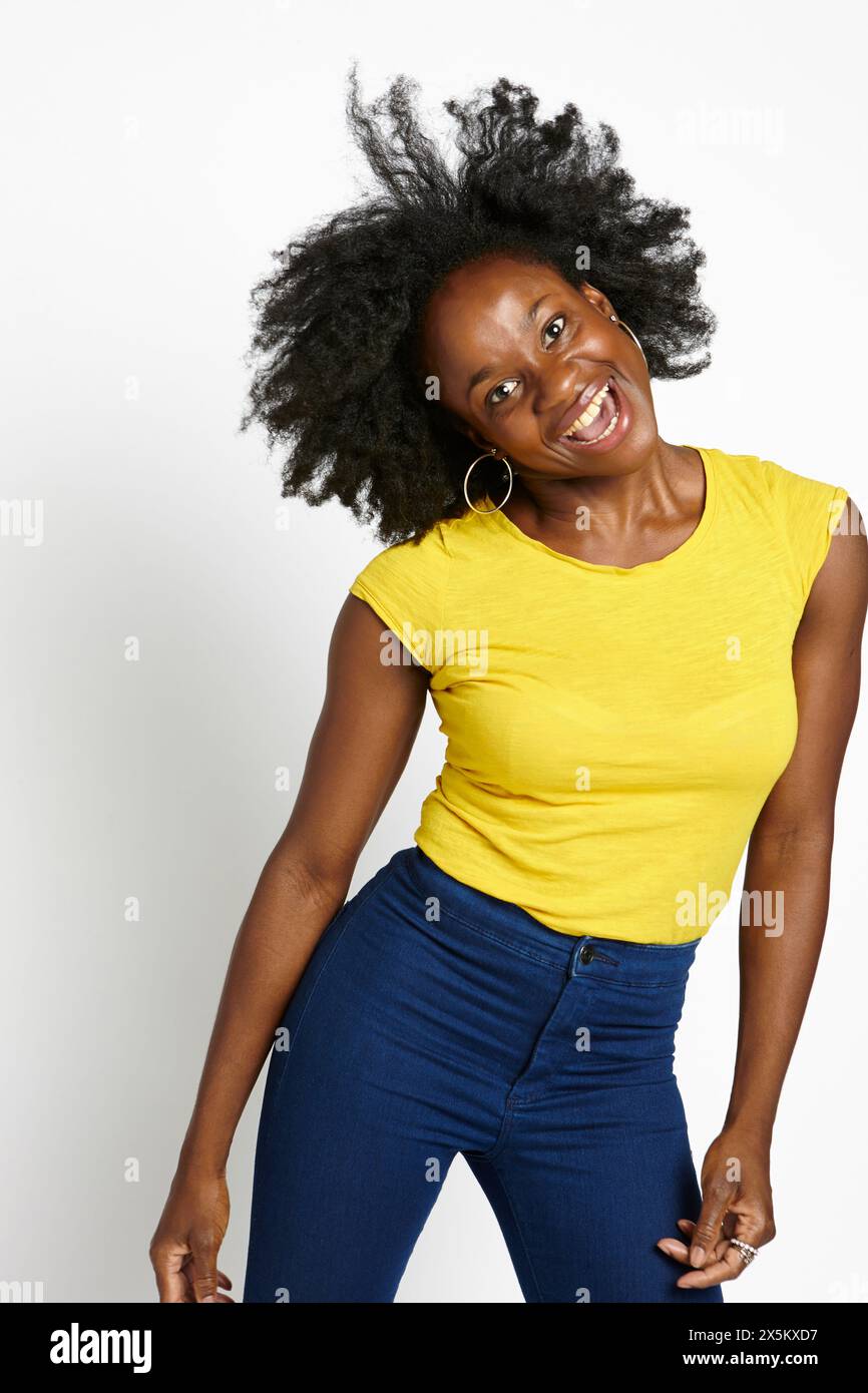 Woman in yellow top hi-res stock photography and images - Alamy