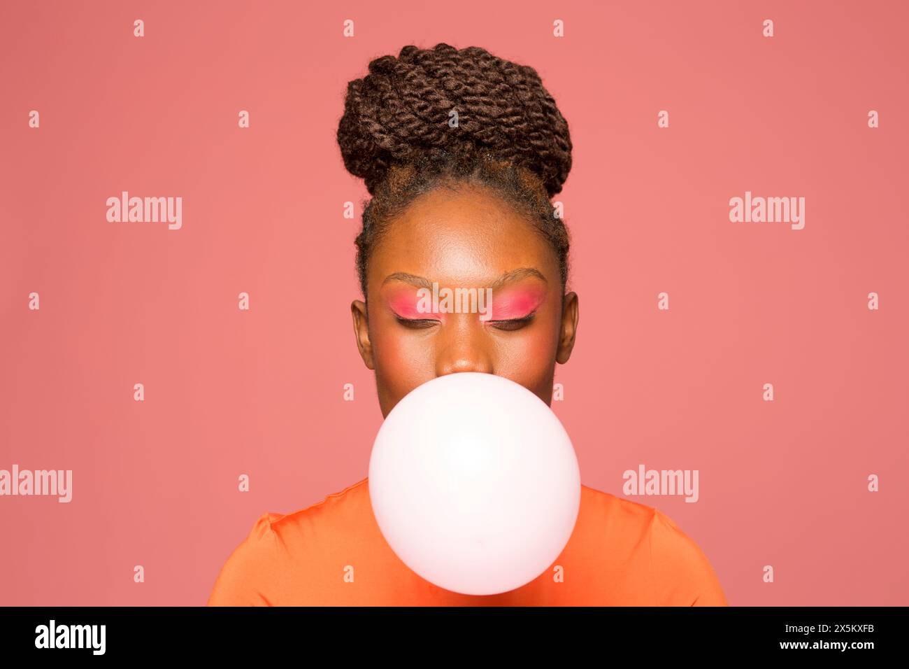 Beautiful woman blowing bubble gum hi-res stock photography and images ...