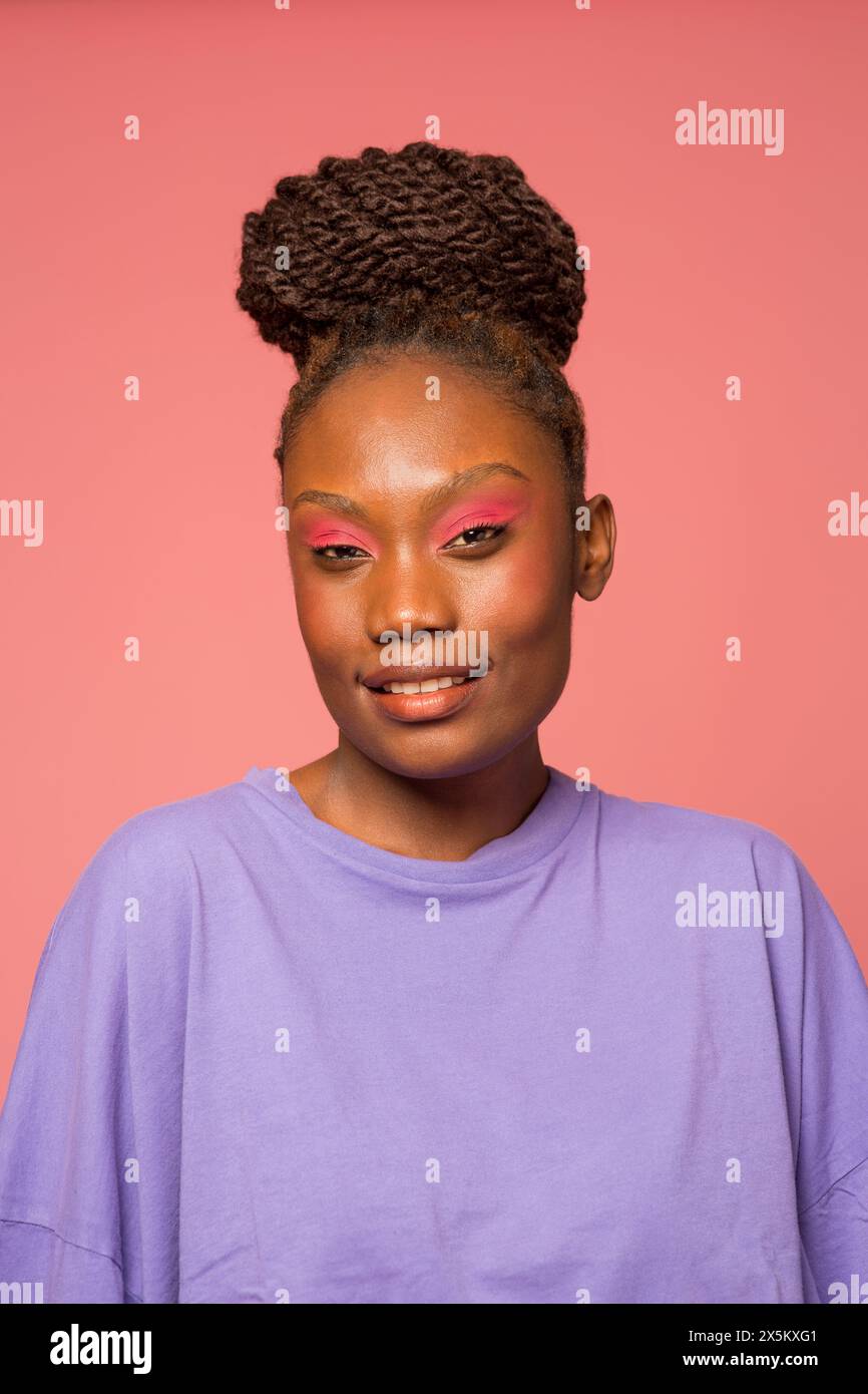 Studio portrait of smiling woman Stock Photo - Alamy