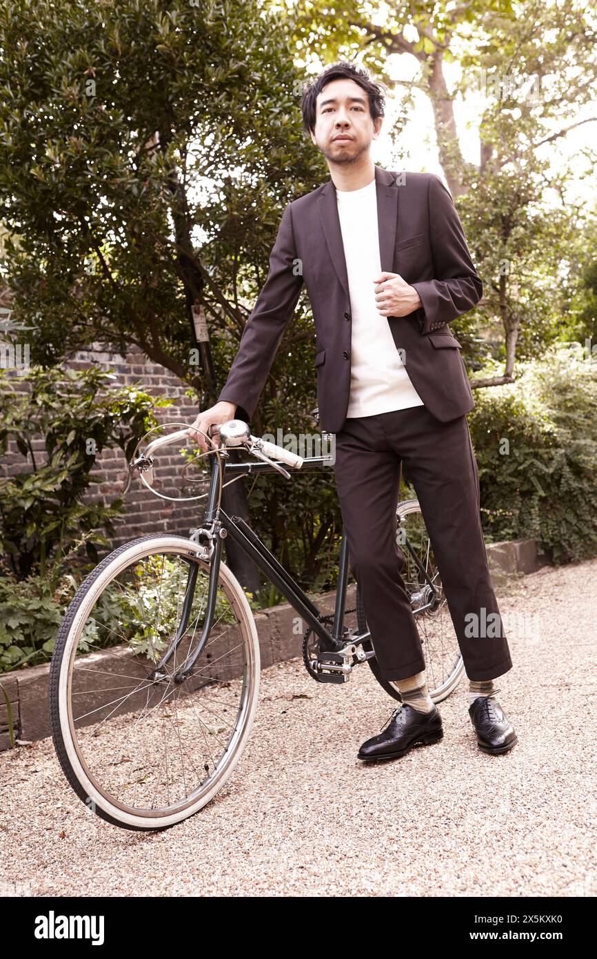 Old man on bike hi-res stock photography and images - Alamy