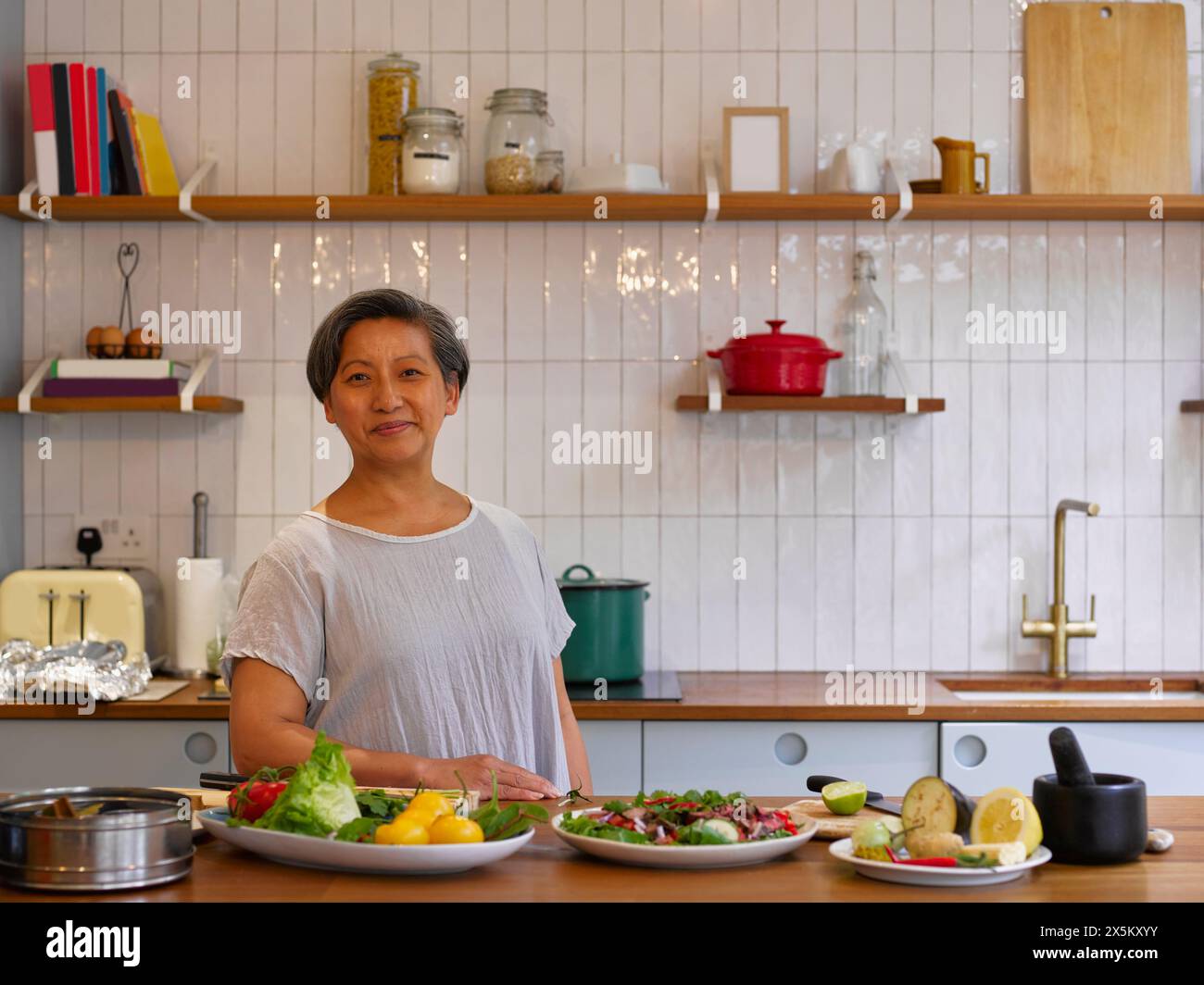 Portrait woman holding plate hi-res stock photography and images - Alamy