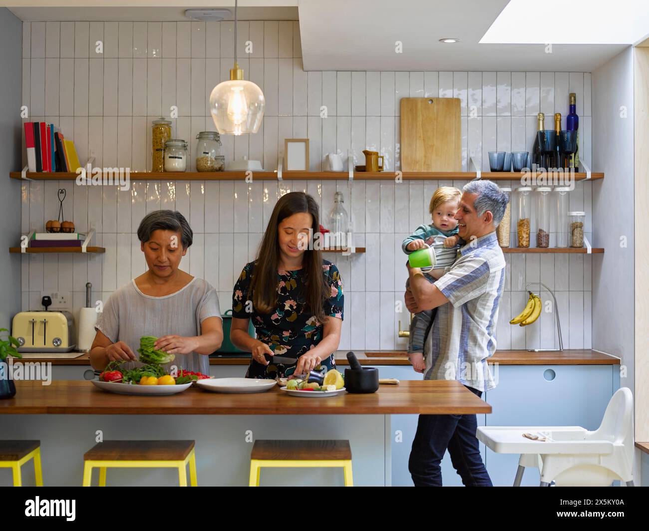 Smiling father preparing food hi-res stock photography and images - Alamy