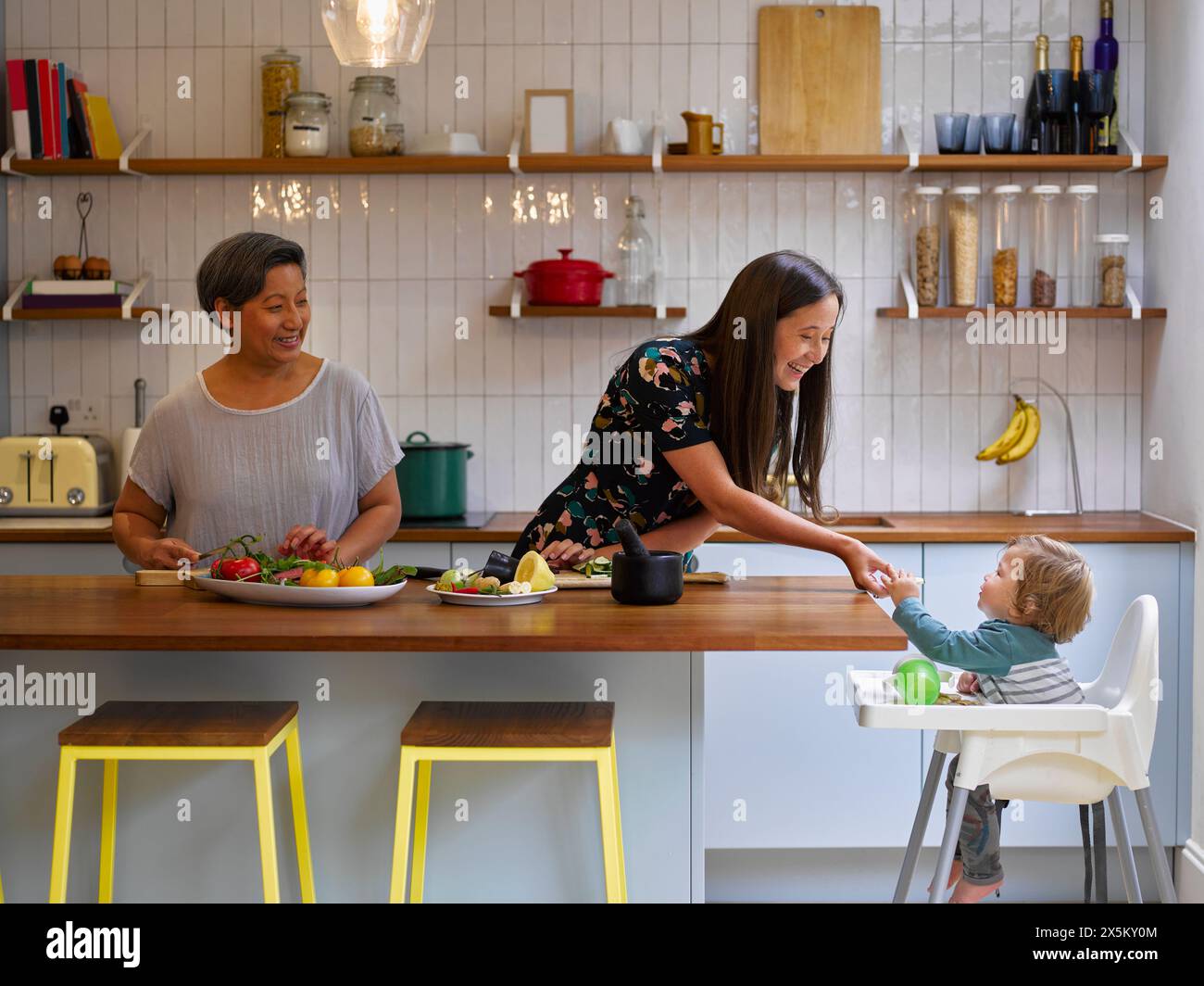 Mother and child kitchen stool hi-res stock photography and images - Alamy