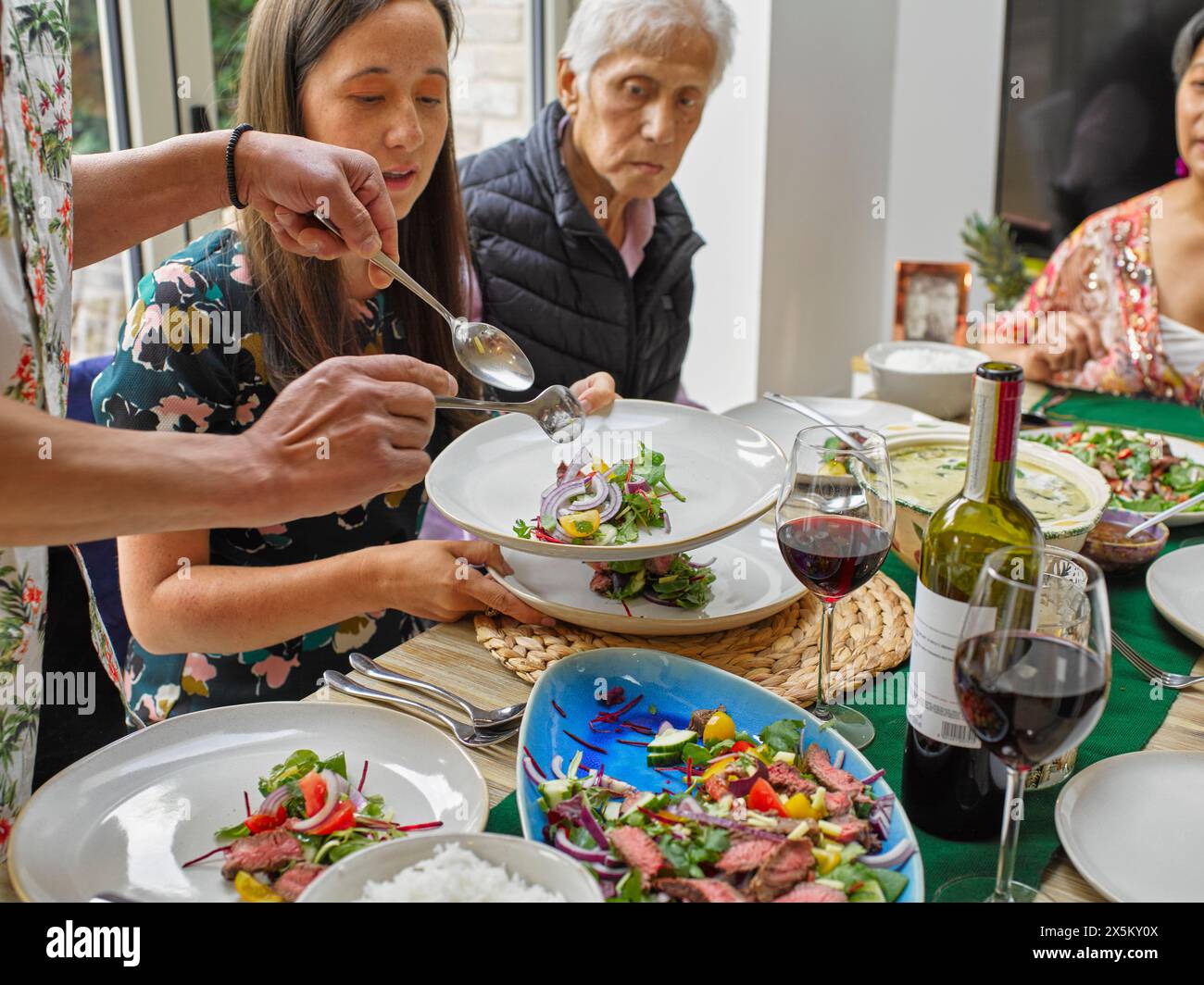 Family having dinner together Stock Photo - Alamy