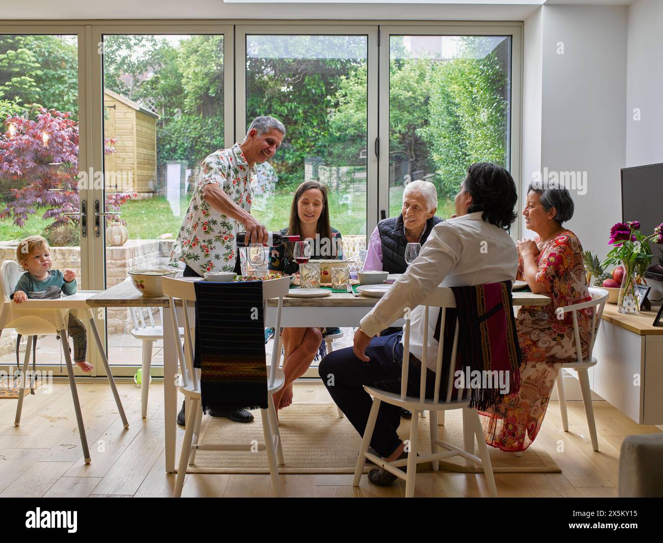 Family having dinner together Stock Photo - Alamy