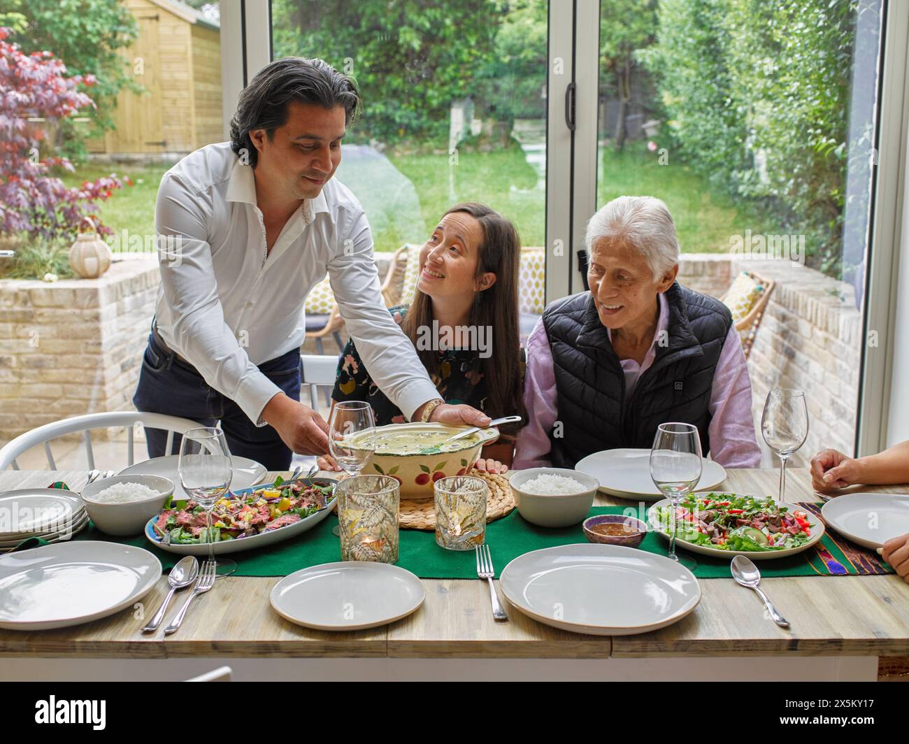 Family having dinner together Stock Photo - Alamy