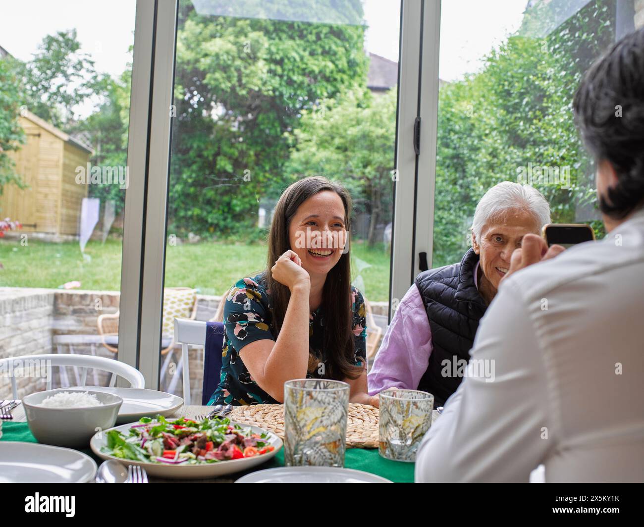Family having dinner together Stock Photo - Alamy