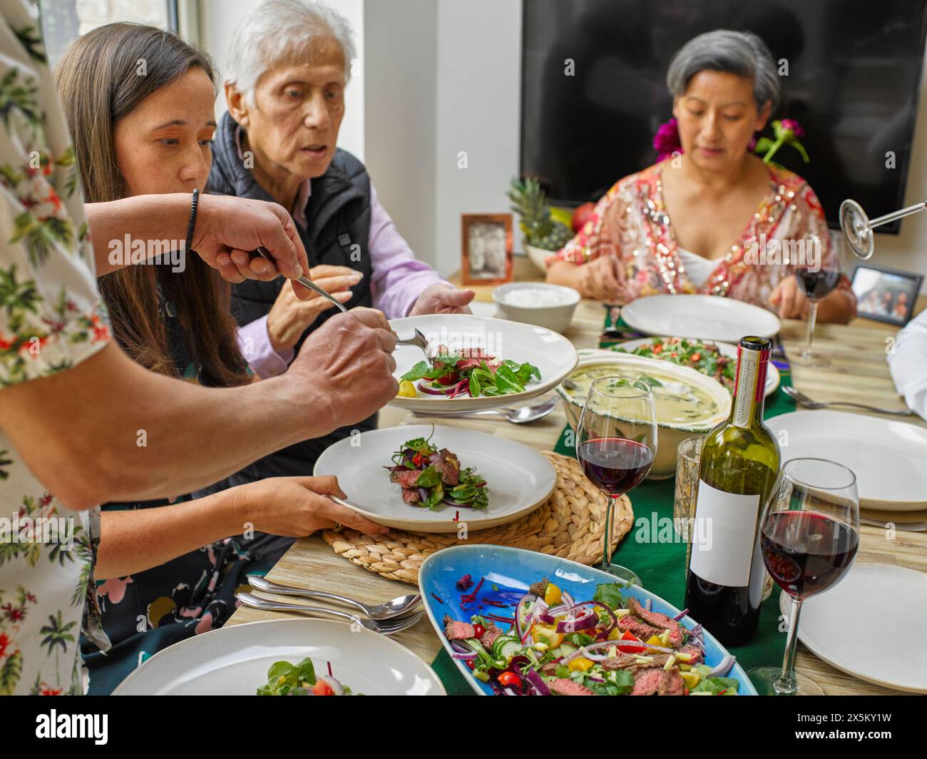Family having dinner together Stock Photo - Alamy