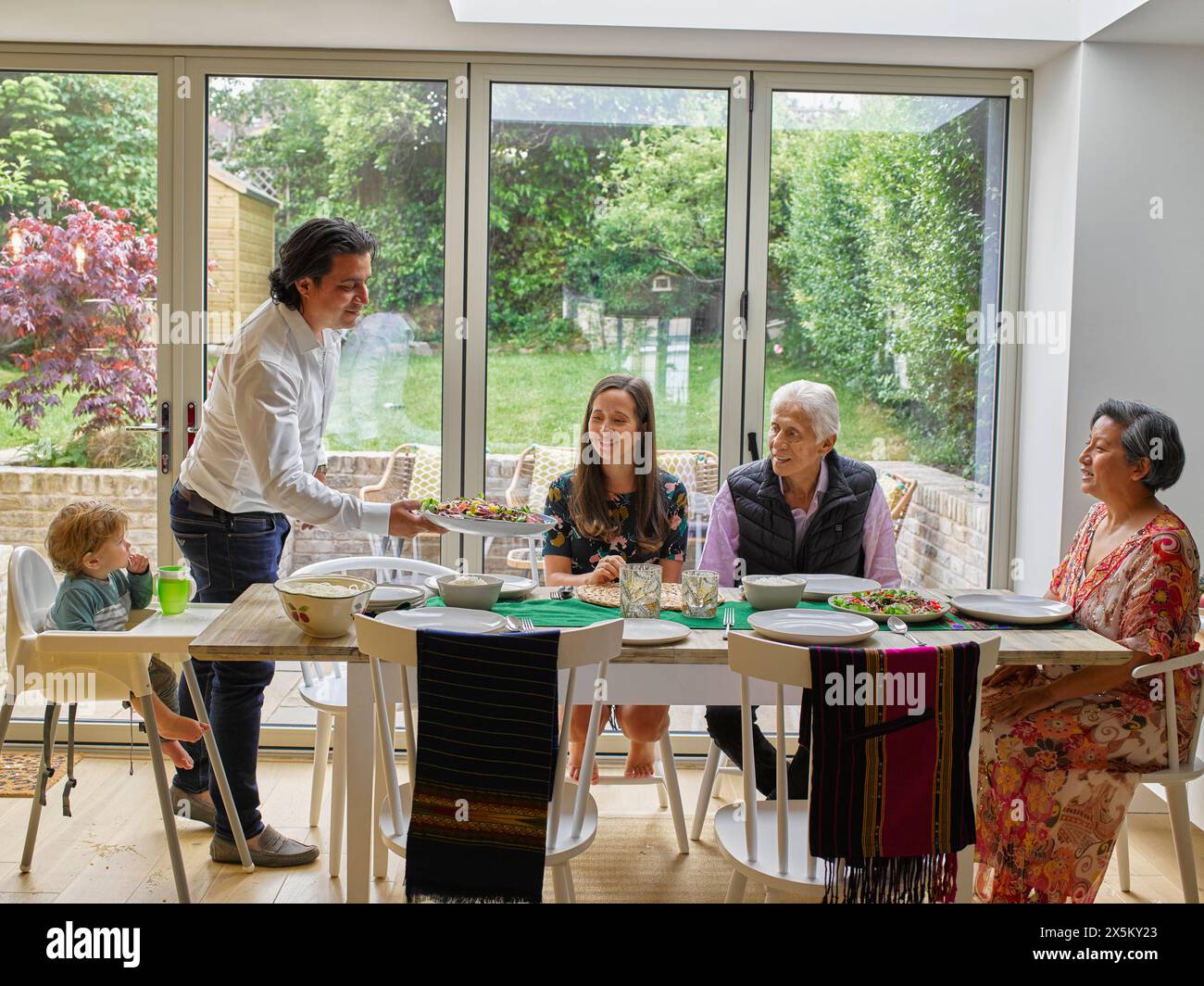 Family having dinner together Stock Photo - Alamy