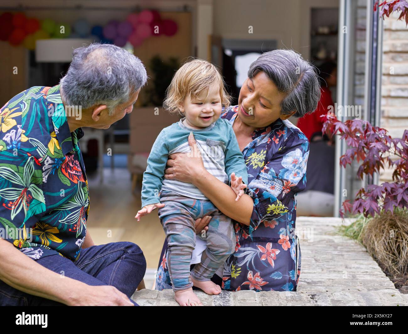 Asian grandparents playing grandchild hi-res stock photography and images - Alamy