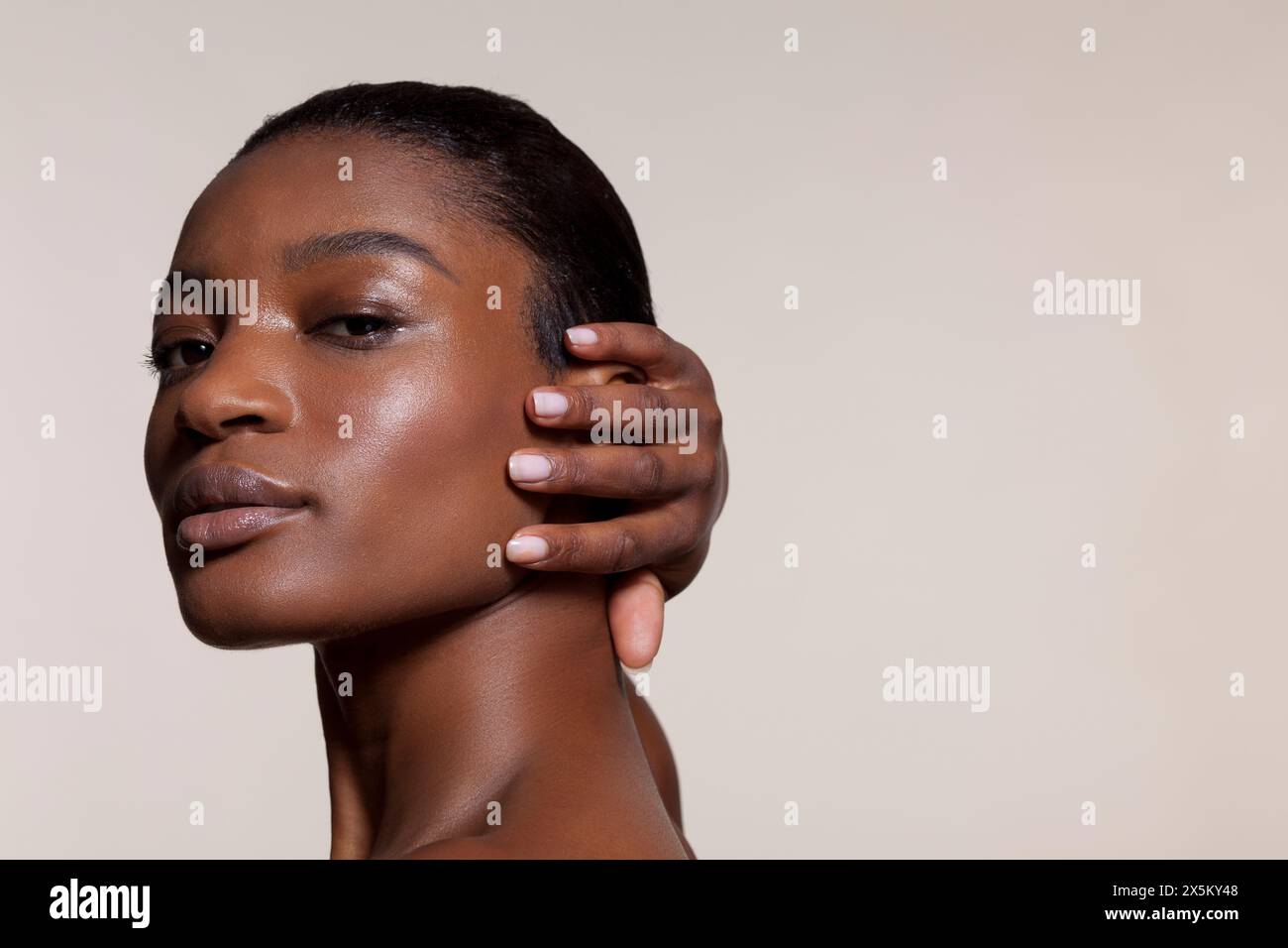 Beautiful woman touching face hi-res stock photography and images - Alamy