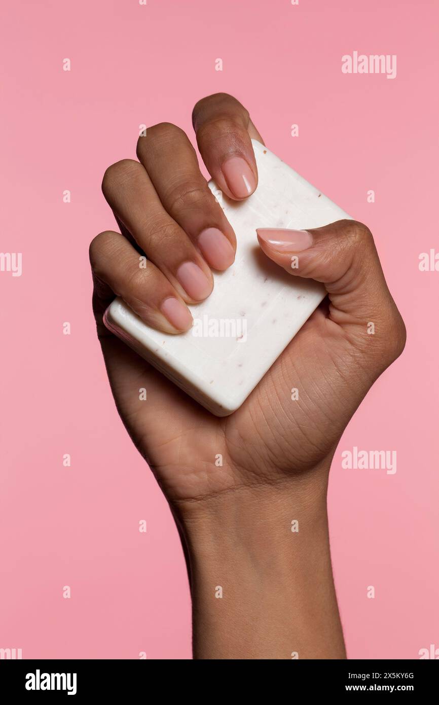 Woman holding bar of soap Stock Photo - Alamy