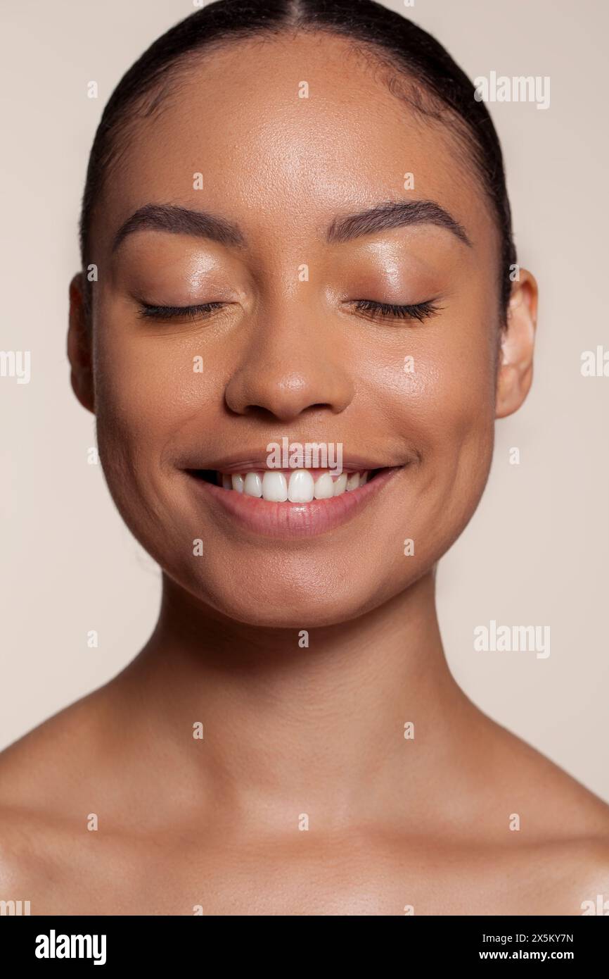 Smiling with closed eyes hi-res stock photography and images - Alamy