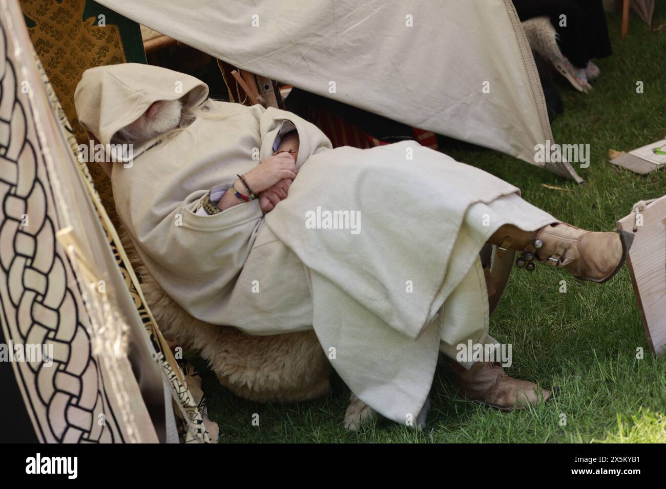 Falkenstein, Germany. 10th May, 2024. A fortune teller sits in a tent ...