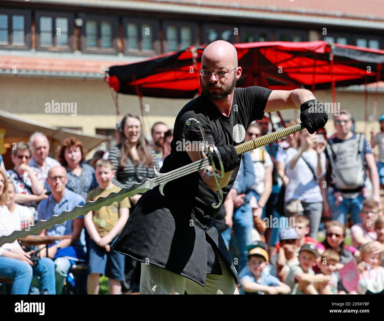 Falkenstein, Germany. 10th May, 2024. Members of a medieval sword ...