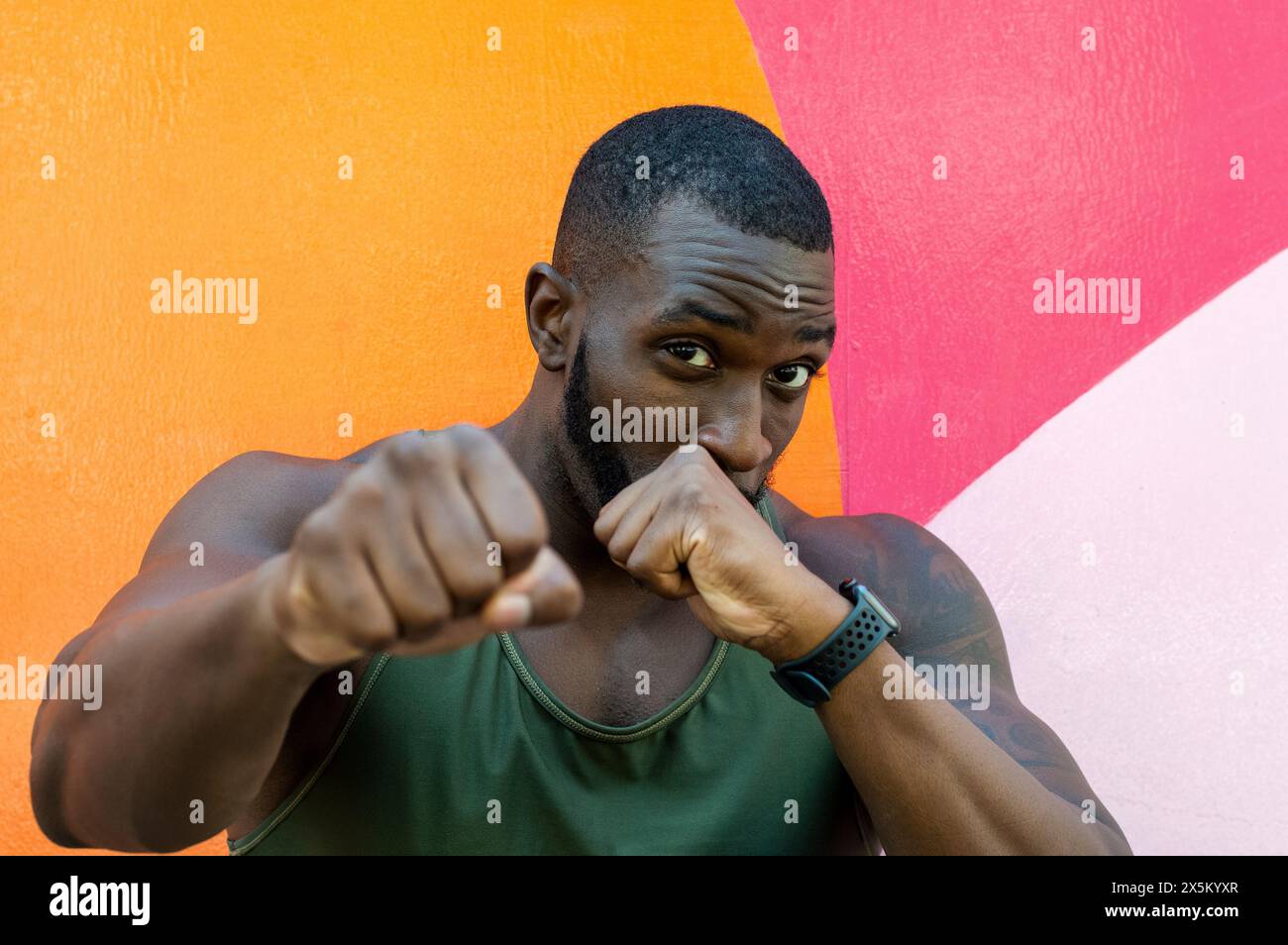 Portrait muscular man clenching fists hi-res stock photography and ...