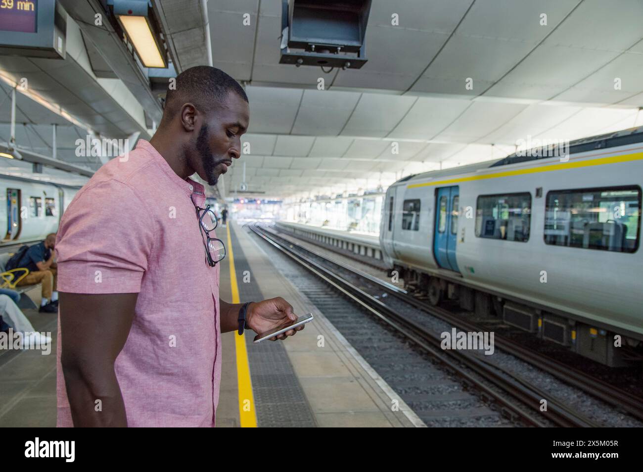 Man on train platform hi-res stock photography and images - Alamy