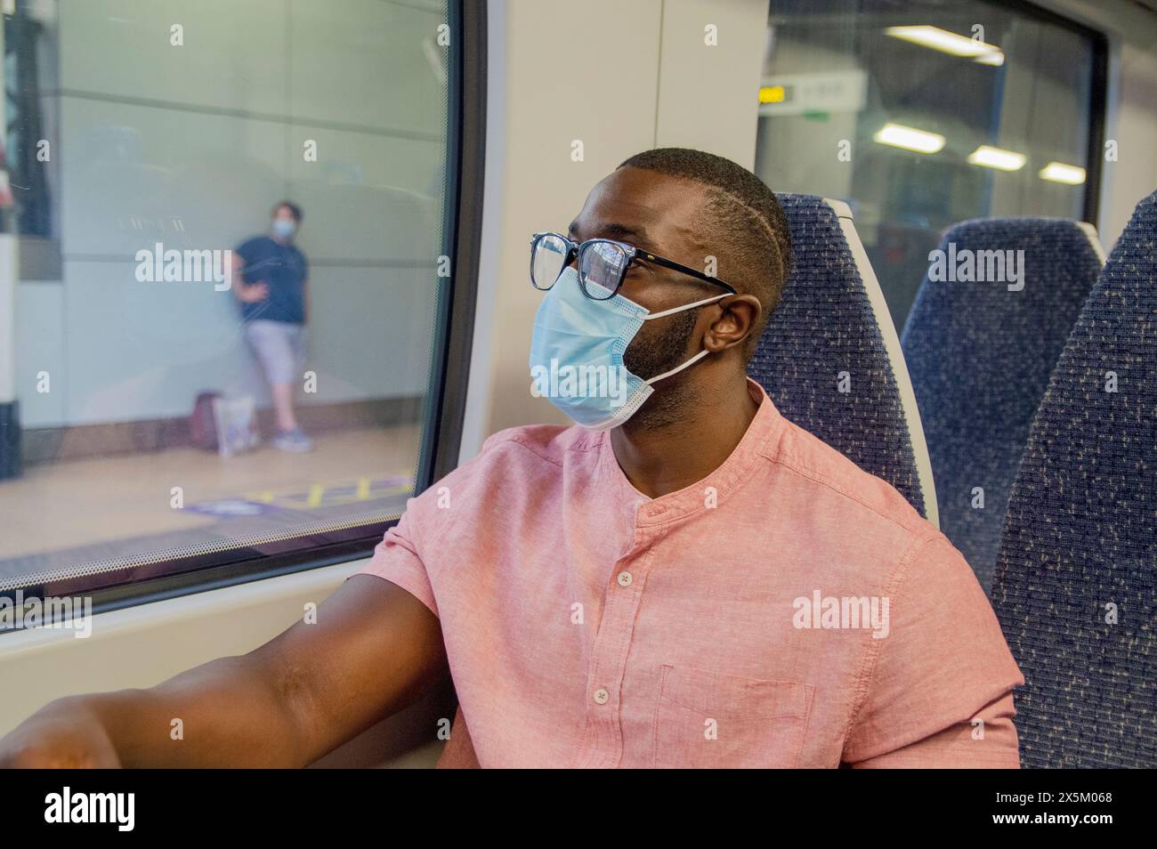 Man passenger in protective hi-res stock photography and images - Alamy