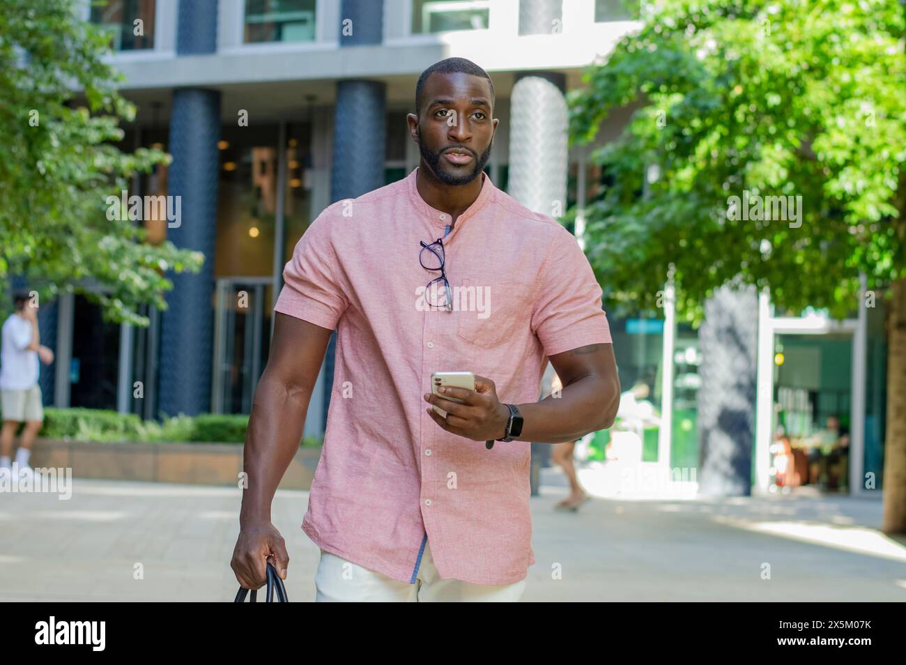 Smart man walking by hi-res stock photography and images - Alamy