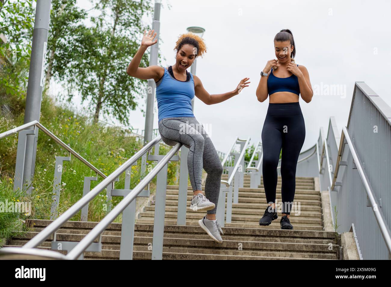 Sliding down the stair rail hi-res stock photography and images - Alamy