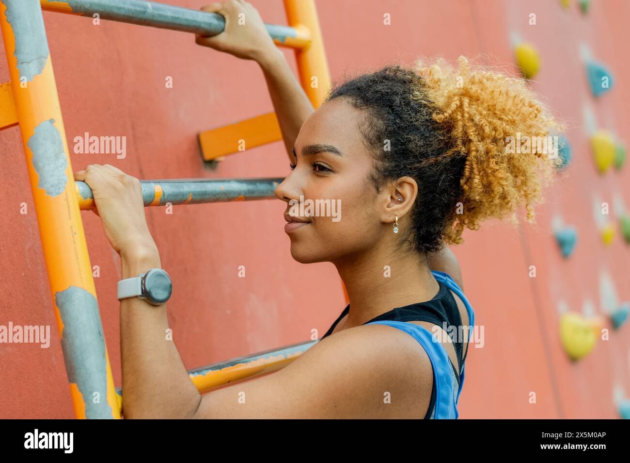 Woman climbing ladder hi-res stock photography and images - Alamy
