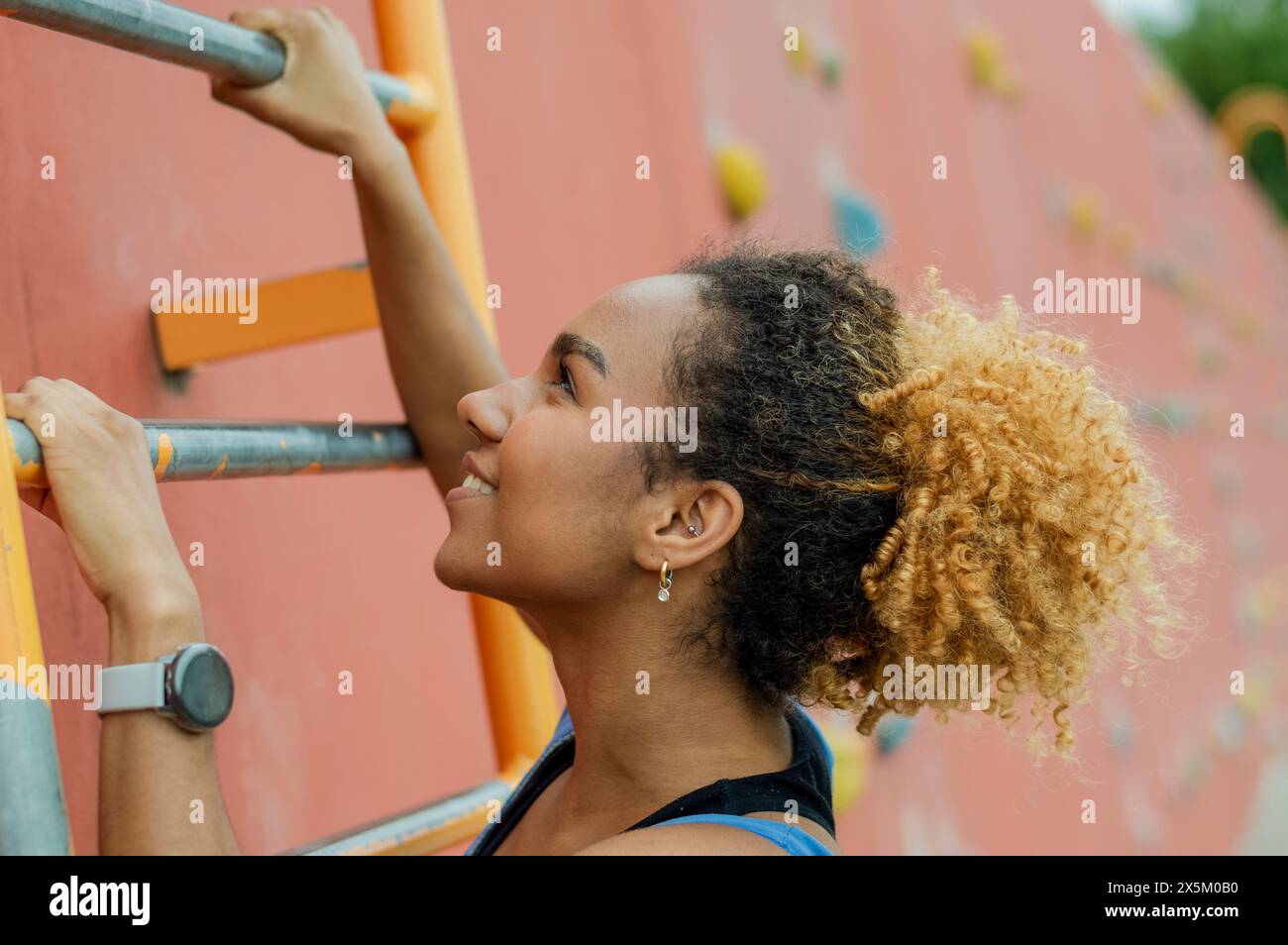 Woman climbing ladder up hi-res stock photography and images - Alamy