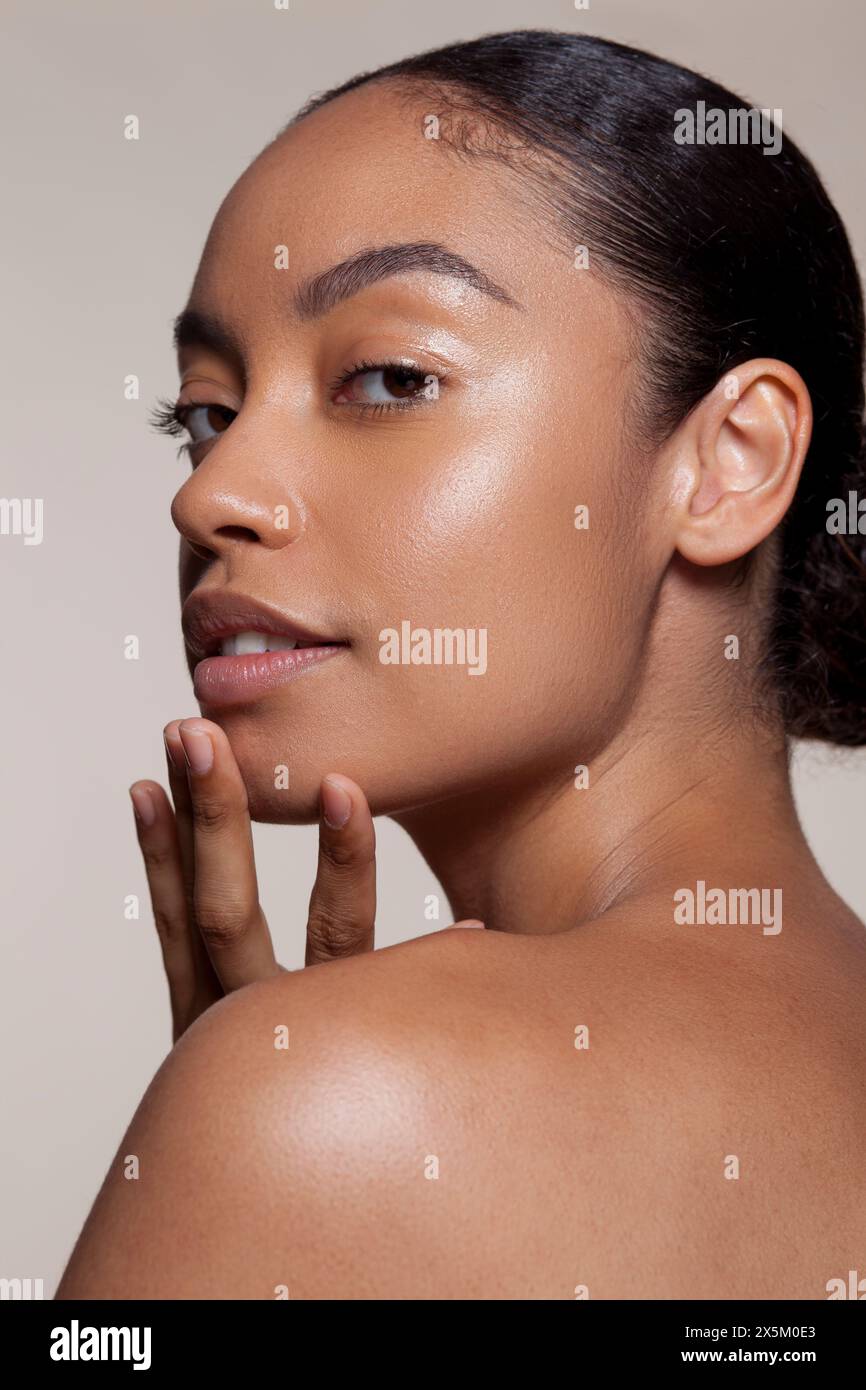 Woman touching face on hi-res stock photography and images - Alamy