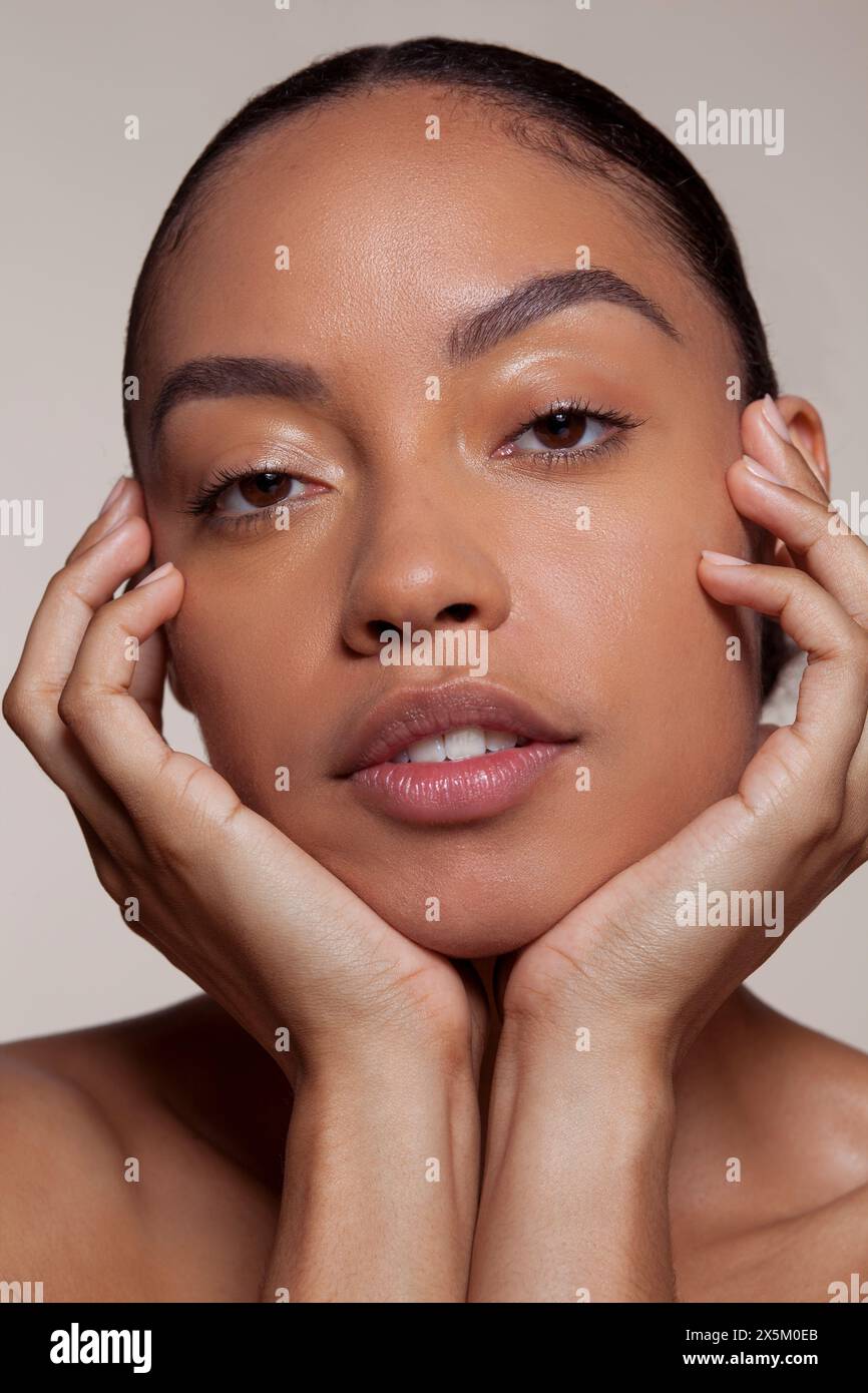 Woman touching face on hi-res stock photography and images - Alamy