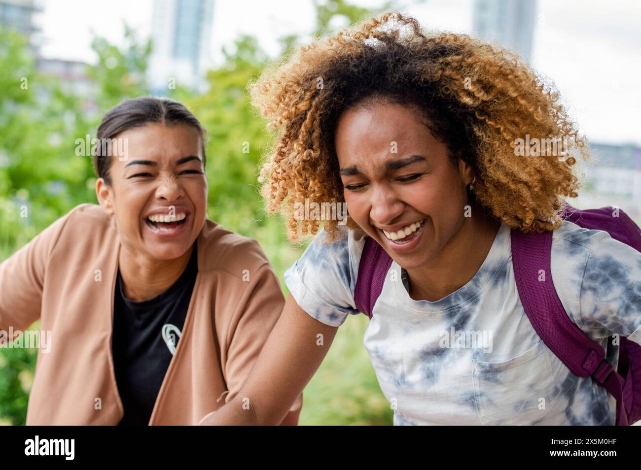 Portrait of two women laughing Stock Photo - Alamy