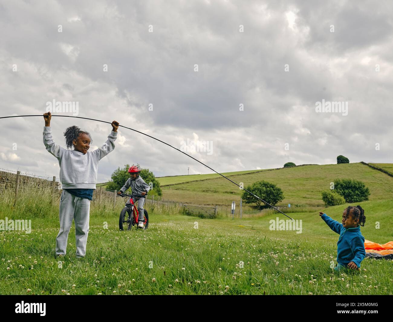 Child playing on grass hi-res stock photography and images - Alamy