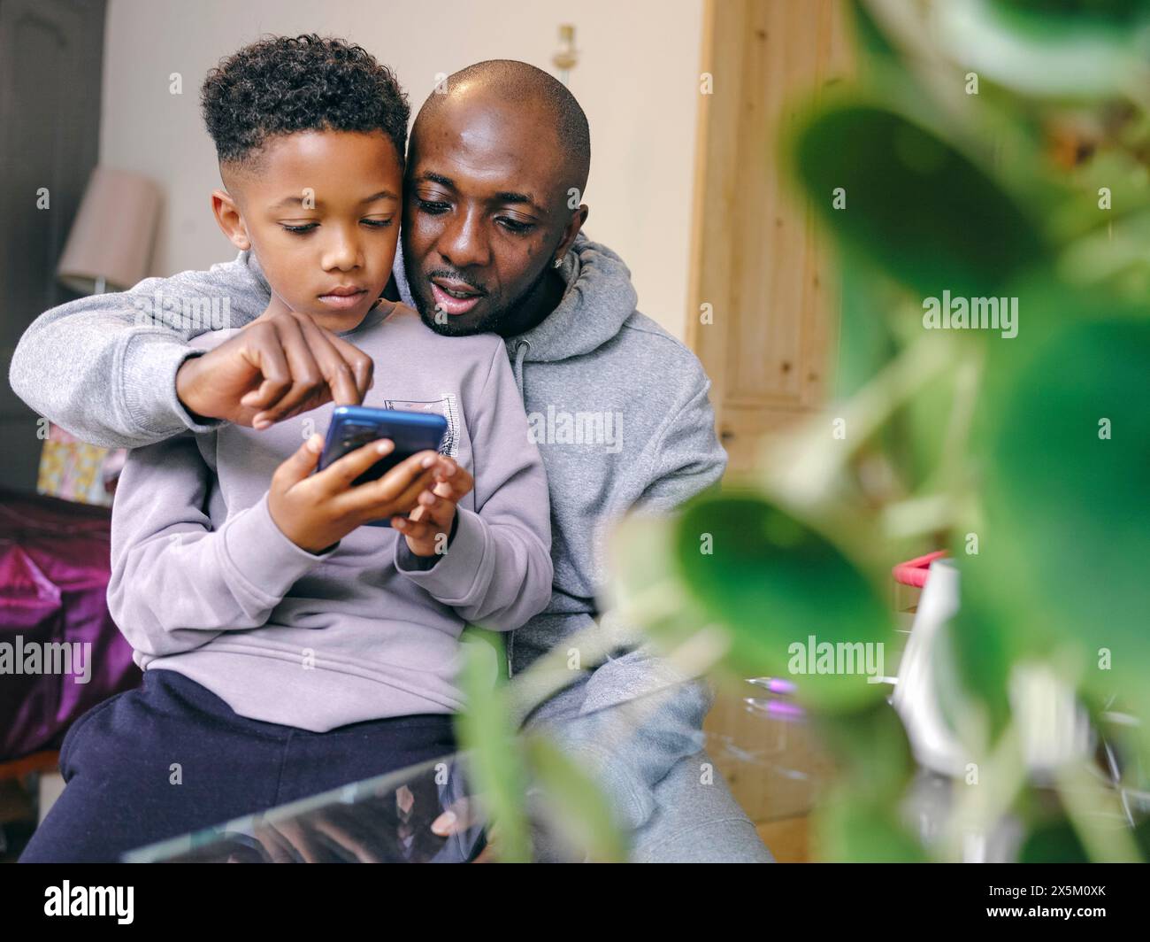 Parent help male child using hi-res stock photography and images - Alamy