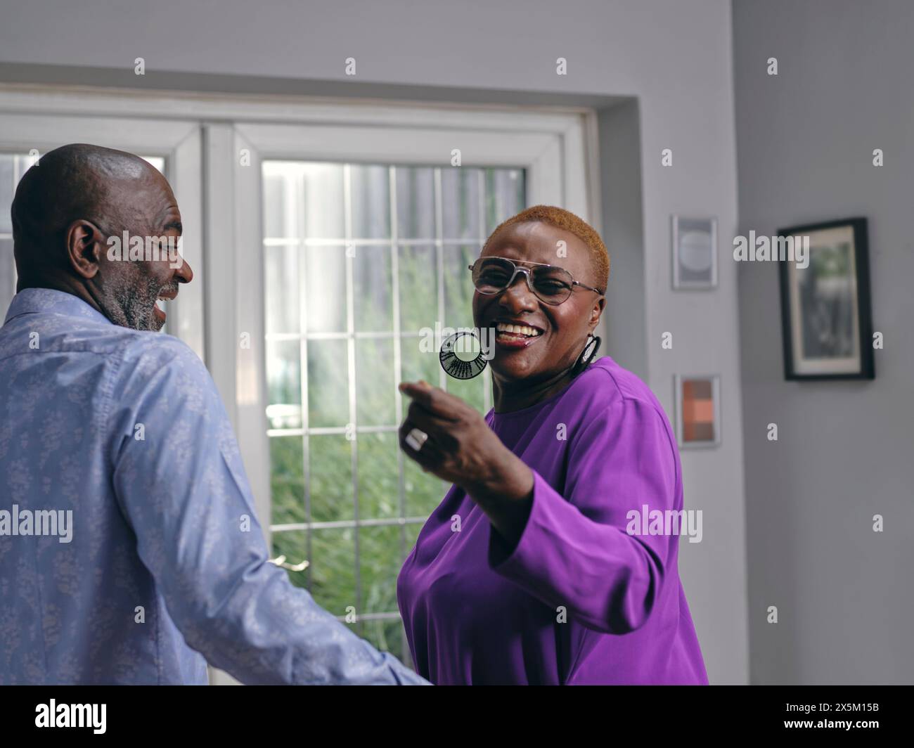 Couple dancing at home Stock Photo - Alamy