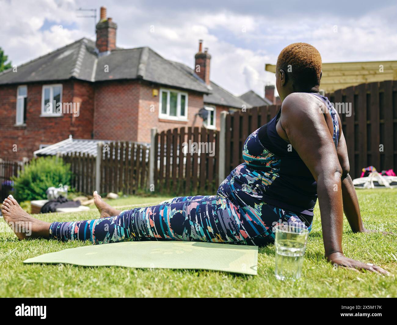 Woman sitting on mat hi-res stock photography and images - Alamy