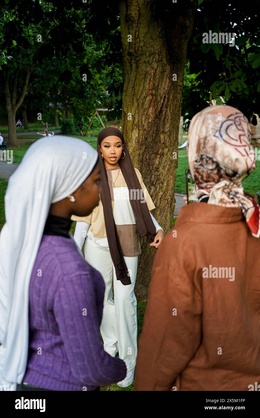 Women talking standing outdoors hi-res stock photography and images - Alamy