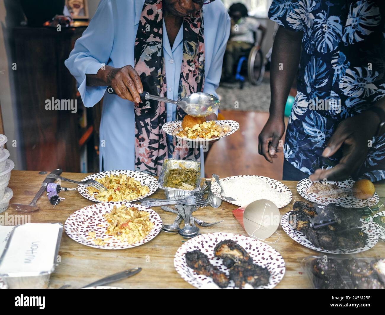 People getting food at party Stock Photo - Alamy