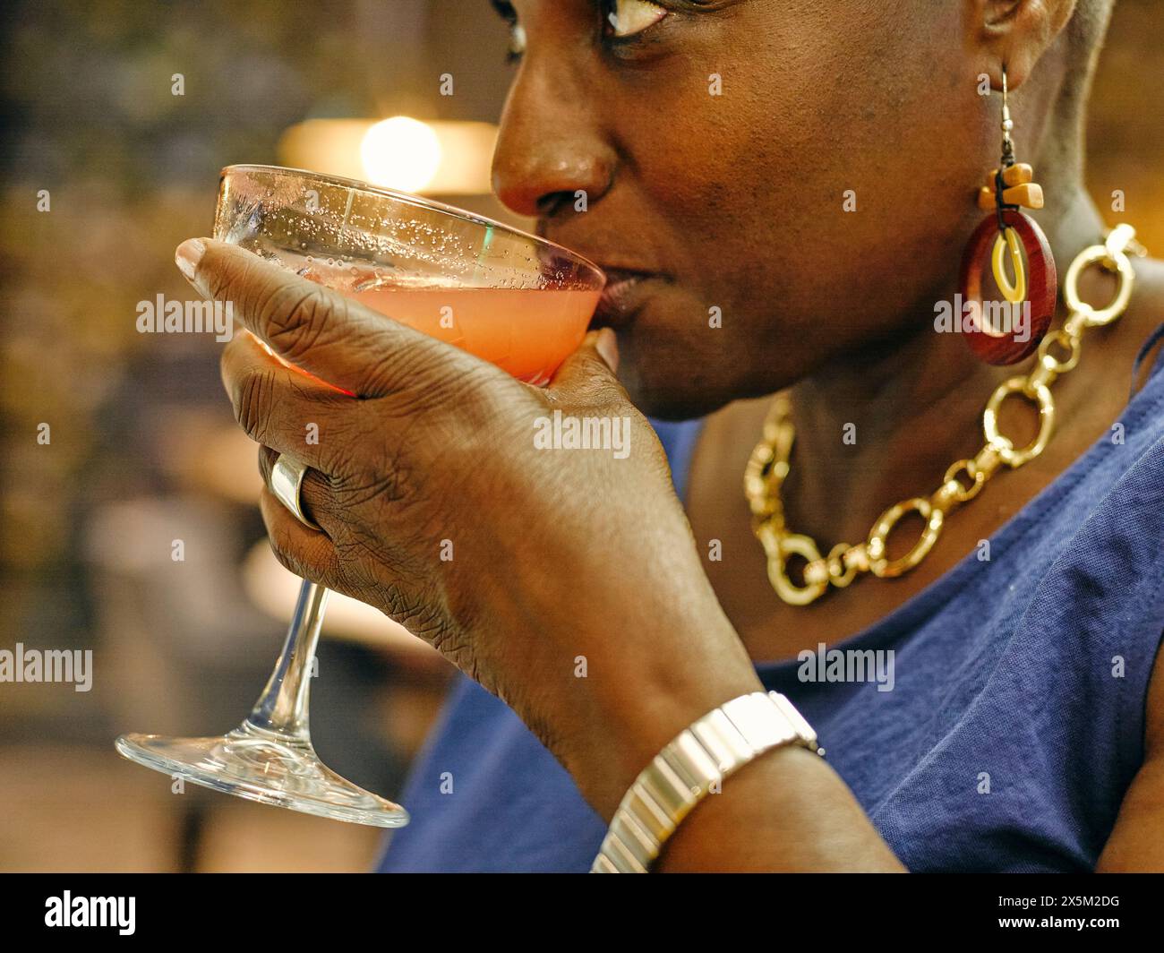 UK, Close-up of mature woman drinking cocktail Stock Photo - Alamy