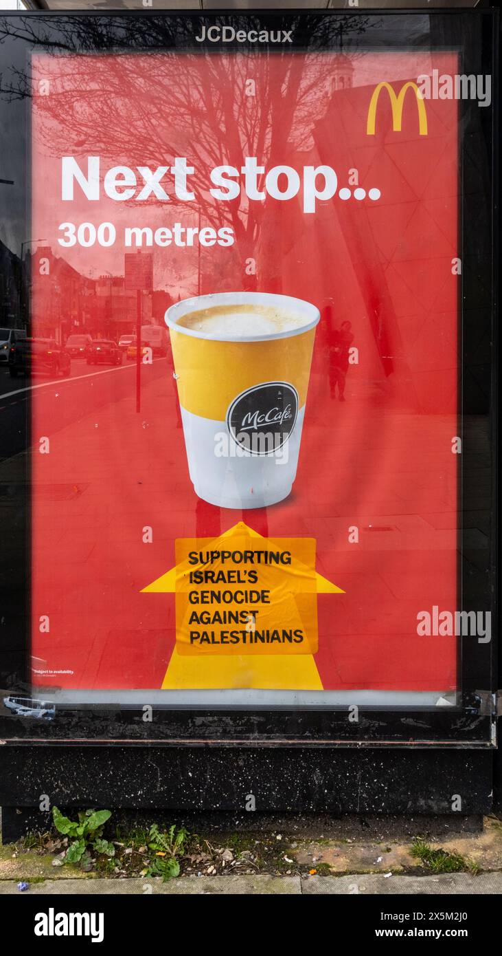 A McDonalds bus stop poster has been overwritten with a protestors ...