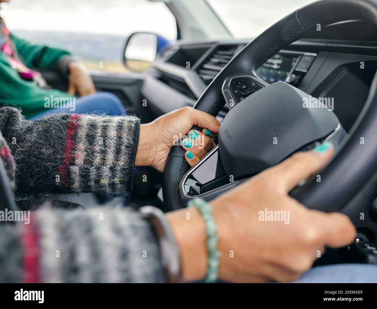 Hands of woman driving car Stock Photo - Alamy