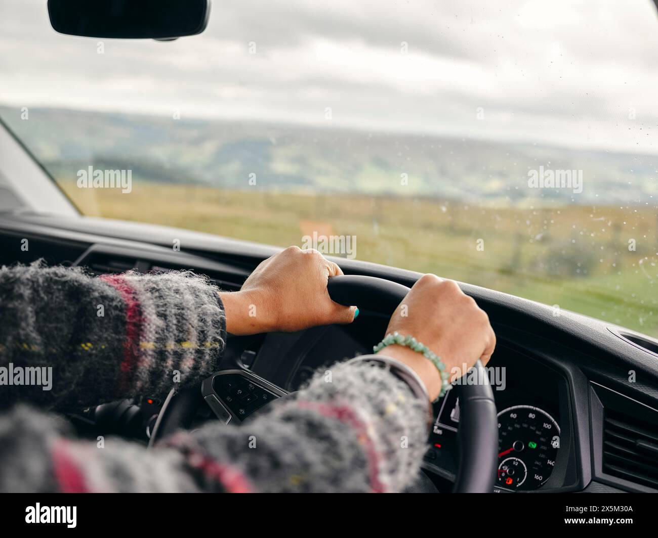Driving car on road hands hi-res stock photography and images - Alamy