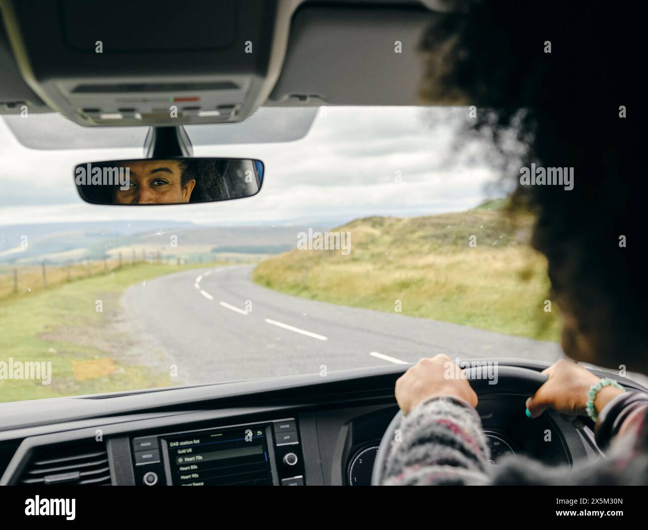 Woman driving car Stock Photo - Alamy